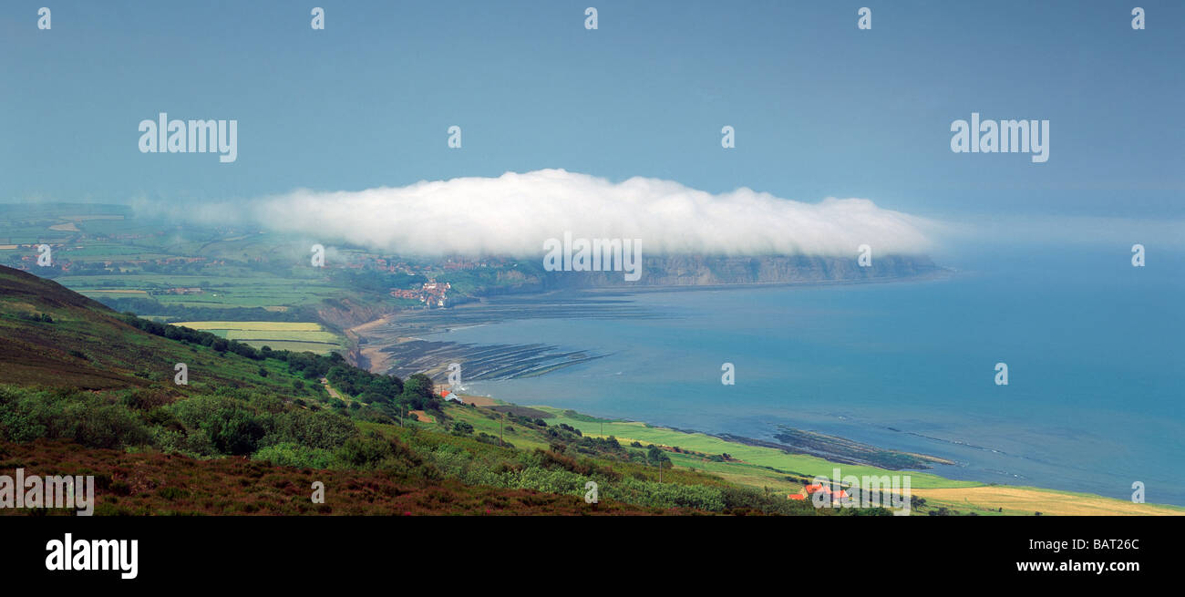 View over Robin Hoods bay to Ness Point shrouded in mist North ...