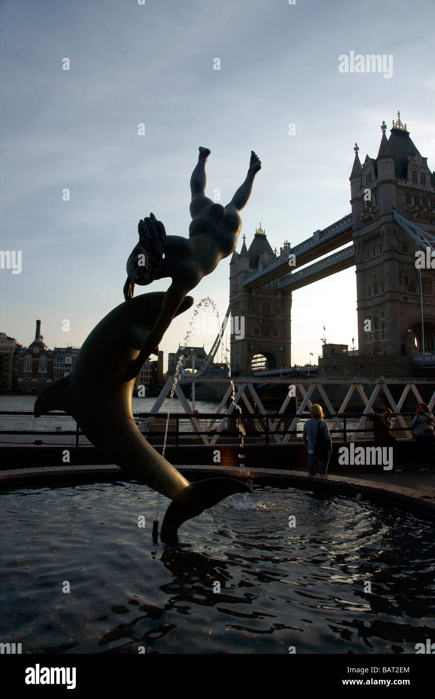 Tower Bridge with dolphin statue in the foreground from the Thames ...
