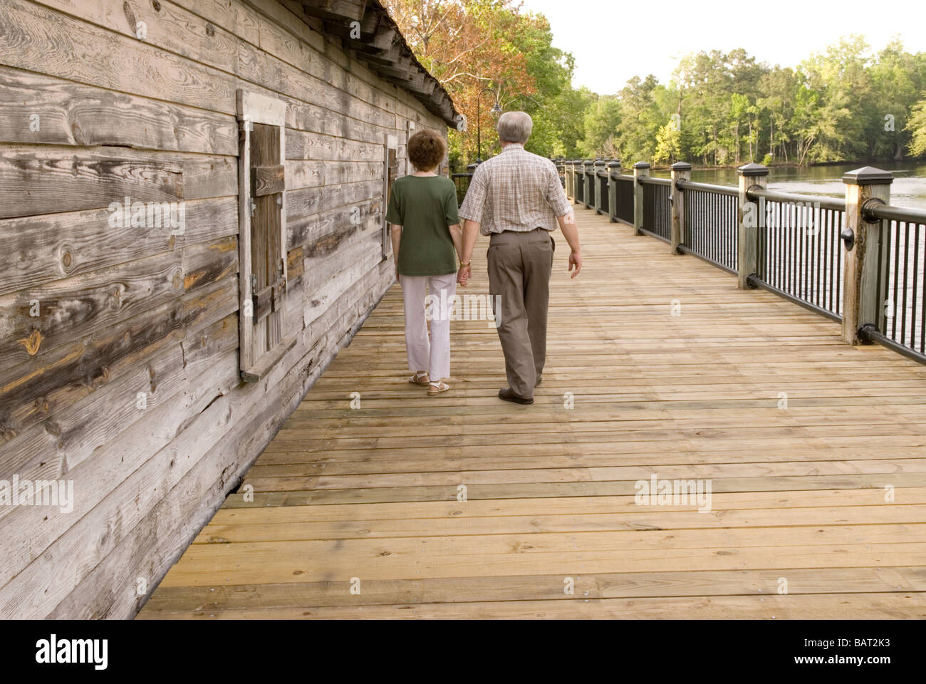 Female walking along river walk hi-res stock photography and images - Alamy