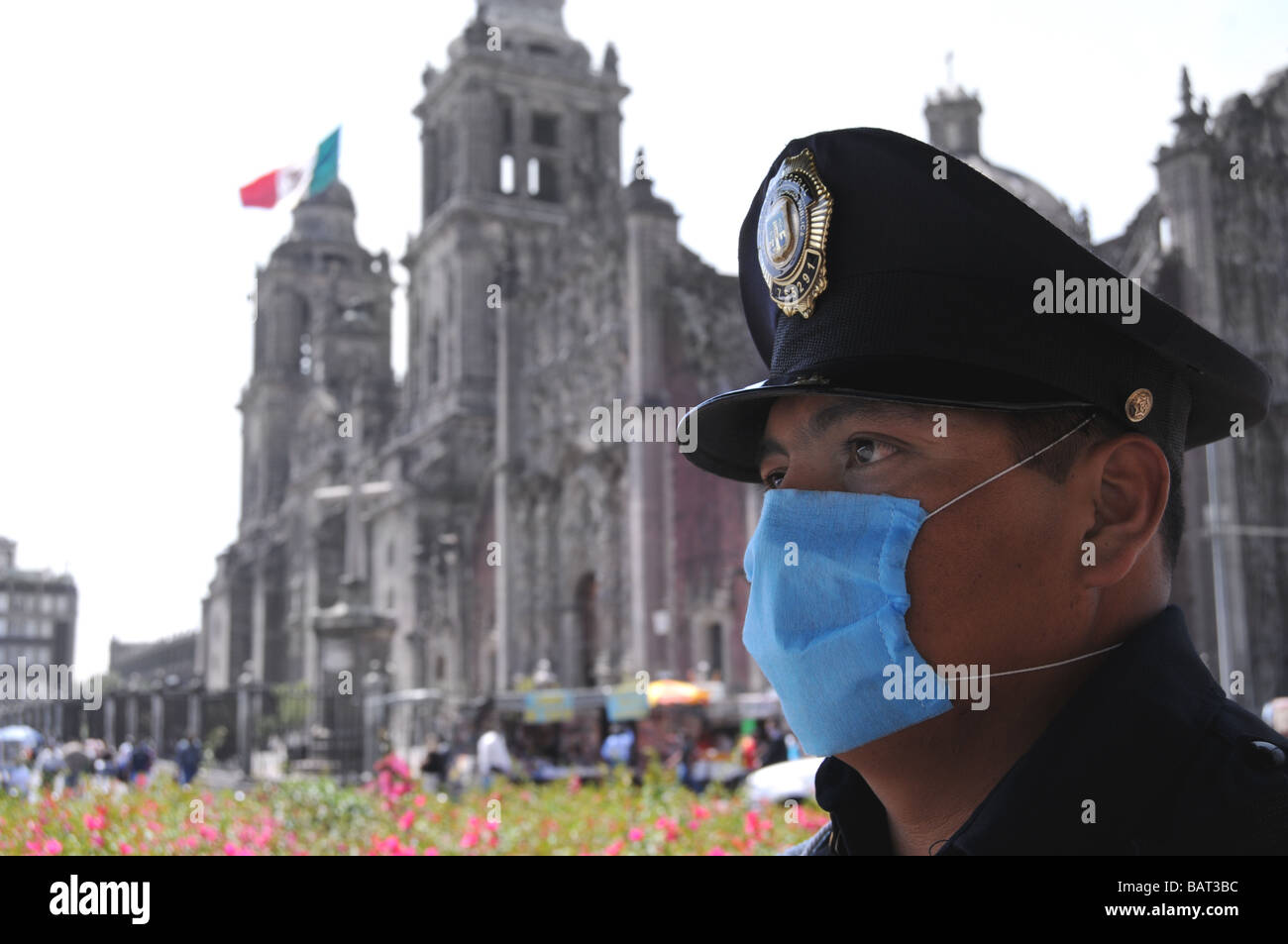 Police office standing guard at Cathedral in downtown Mexico City ...