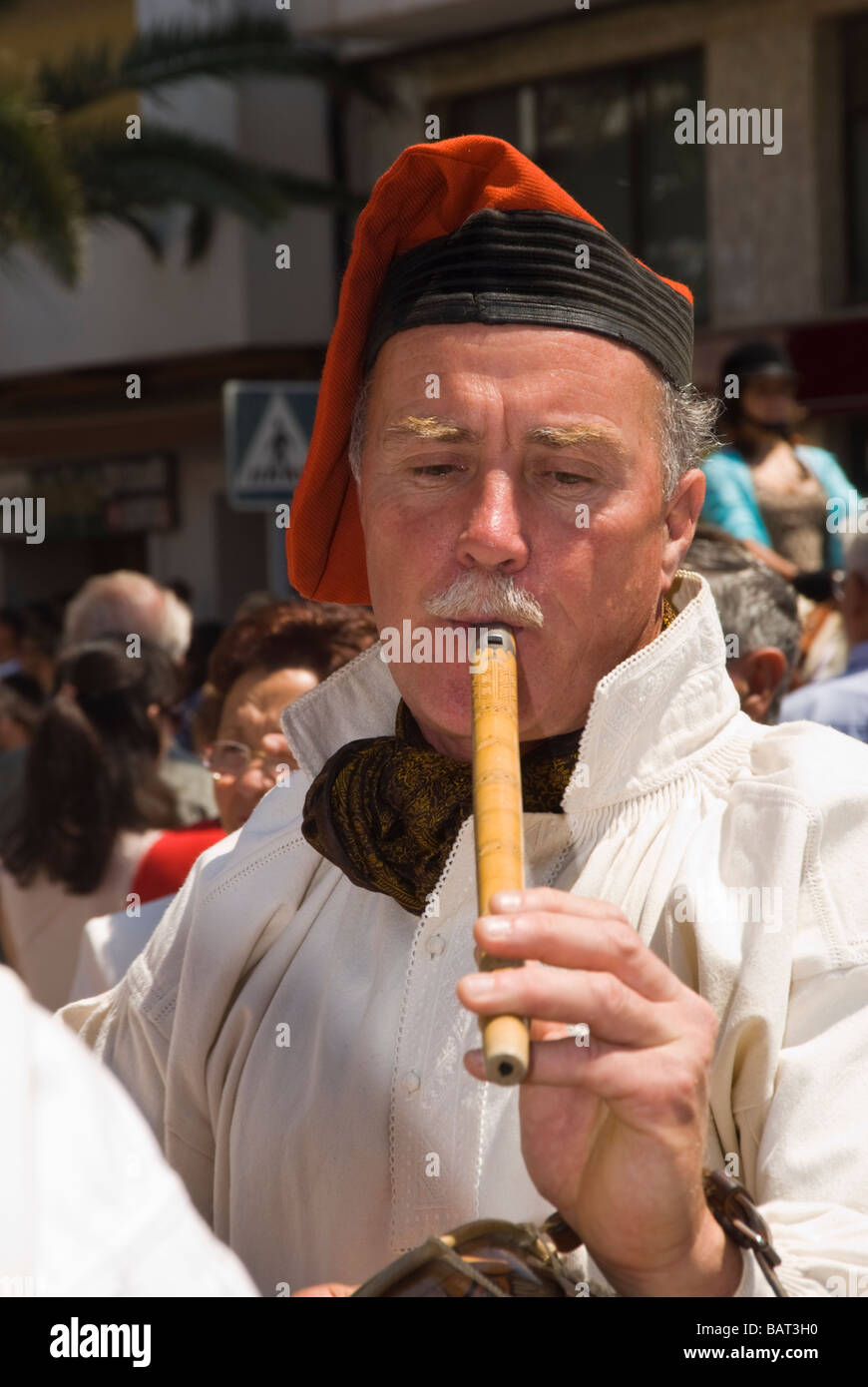 Portrait of a flute and drum player, member of a Folklore dance group ...