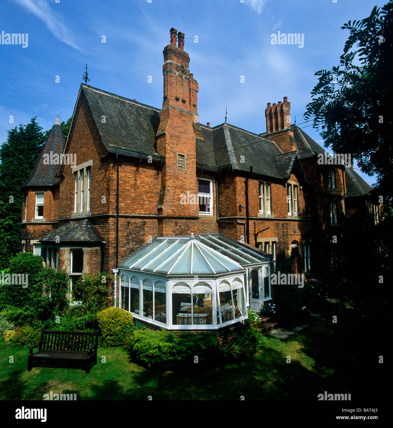View of an Old English brick Rectory house showing large chimney stack ...
