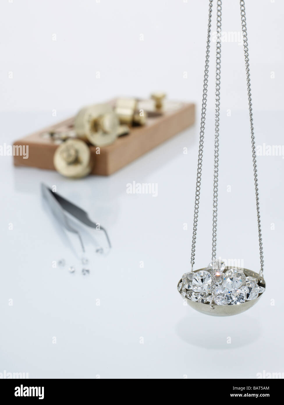 Diamonds on carat scale Stock Photo - Alamy