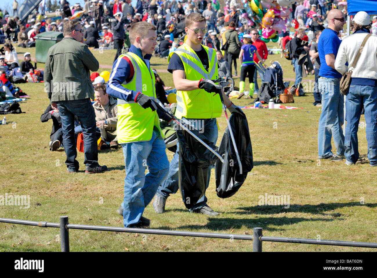The park cleners boys are cleaning the May Day picnic depris in the ...