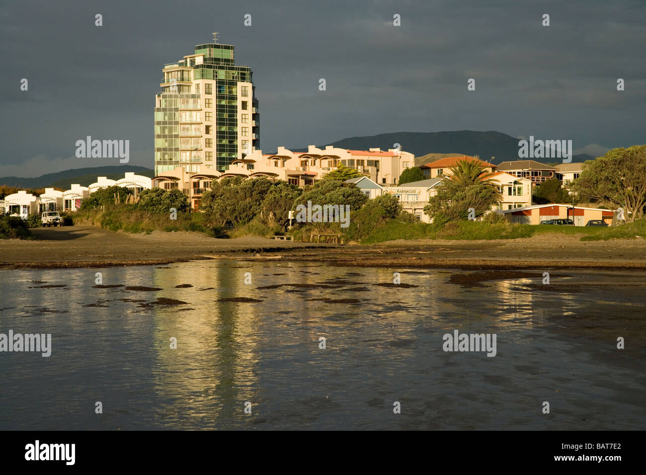 Highrise building reflected on Paraparaumu Beach Kapiti Coast North ...