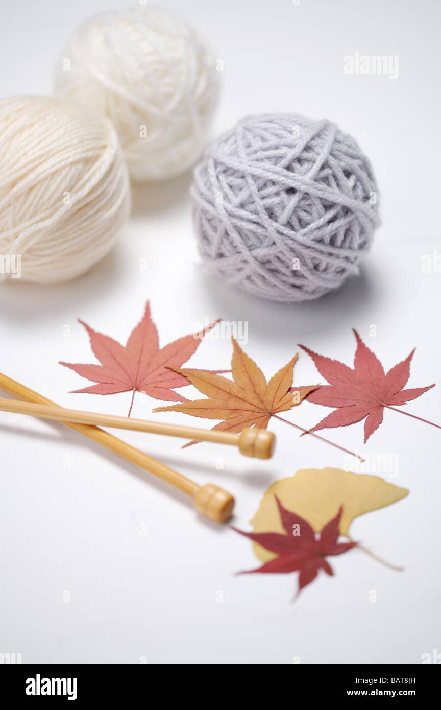 Maple leaves and balls of wool Stock Photo - Alamy