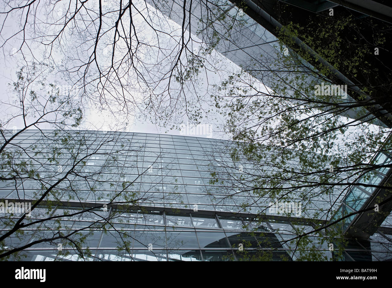 modern office buildings with trees in front of them Stock Photo - Alamy
