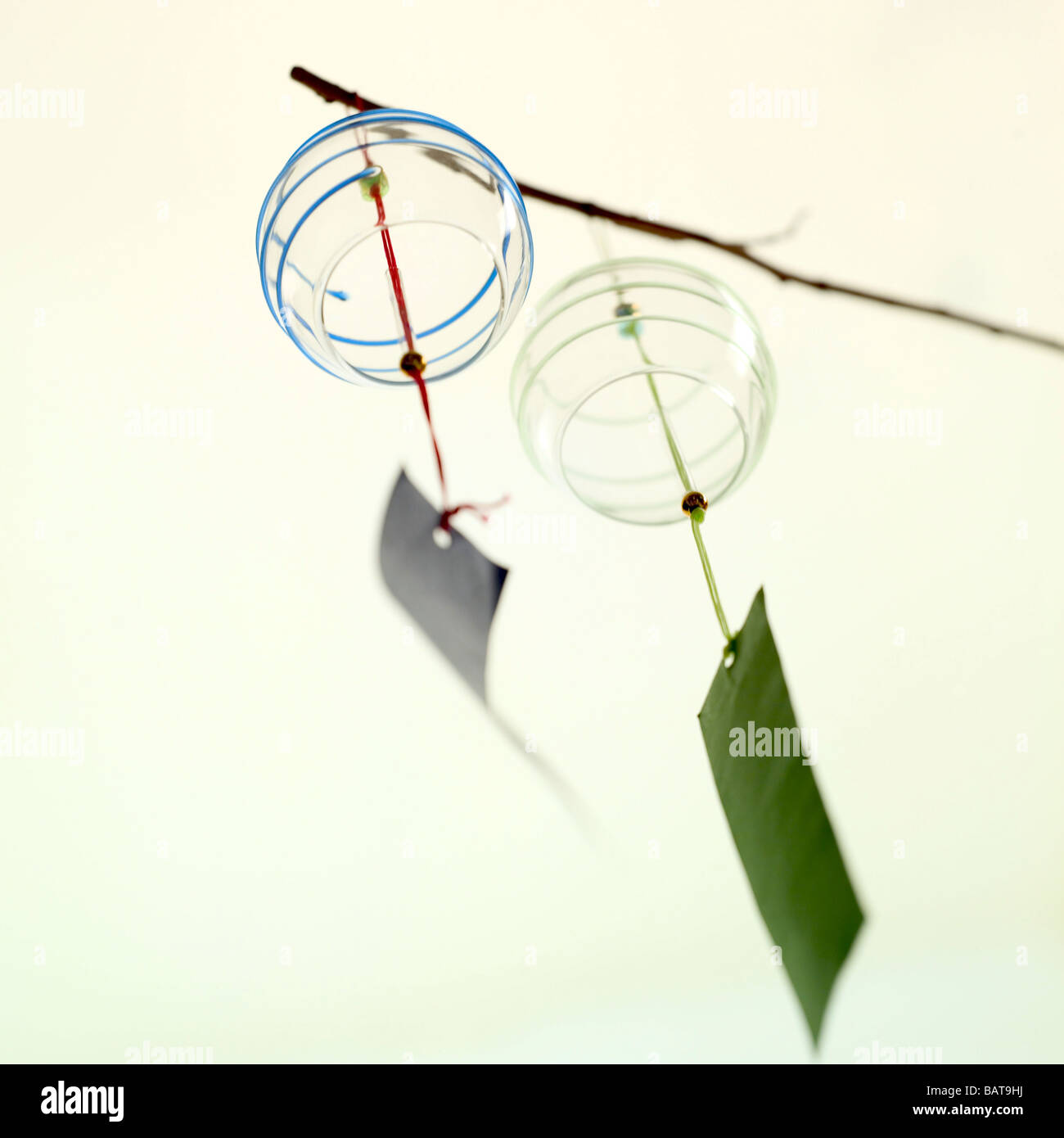 Wind bells hanging on a branch Stock Photo - Alamy