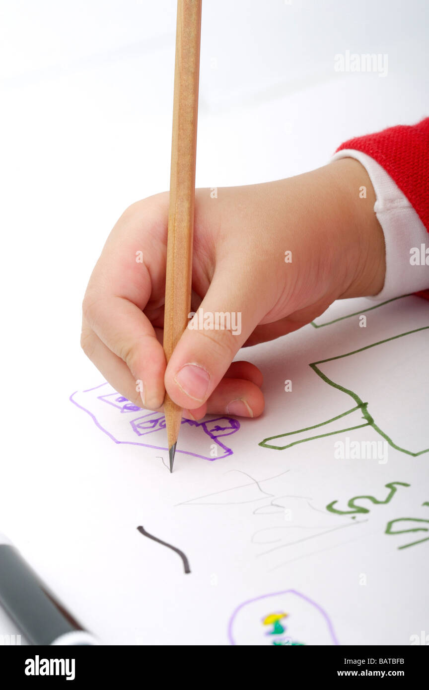Boy drawing on paper Stock Photo - Alamy