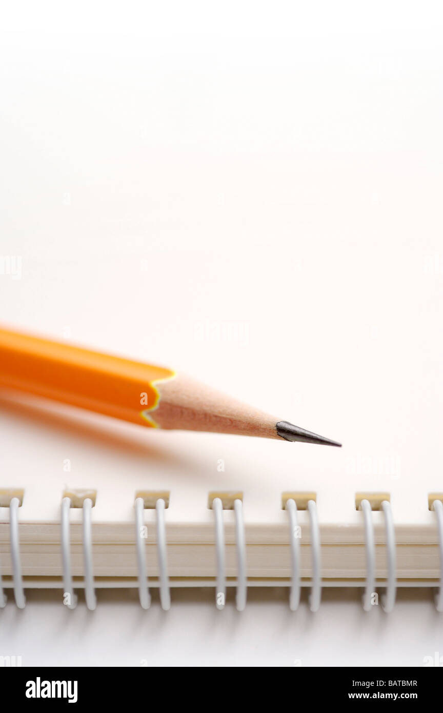 Spiral notebook and pencils Stock Photo - Alamy