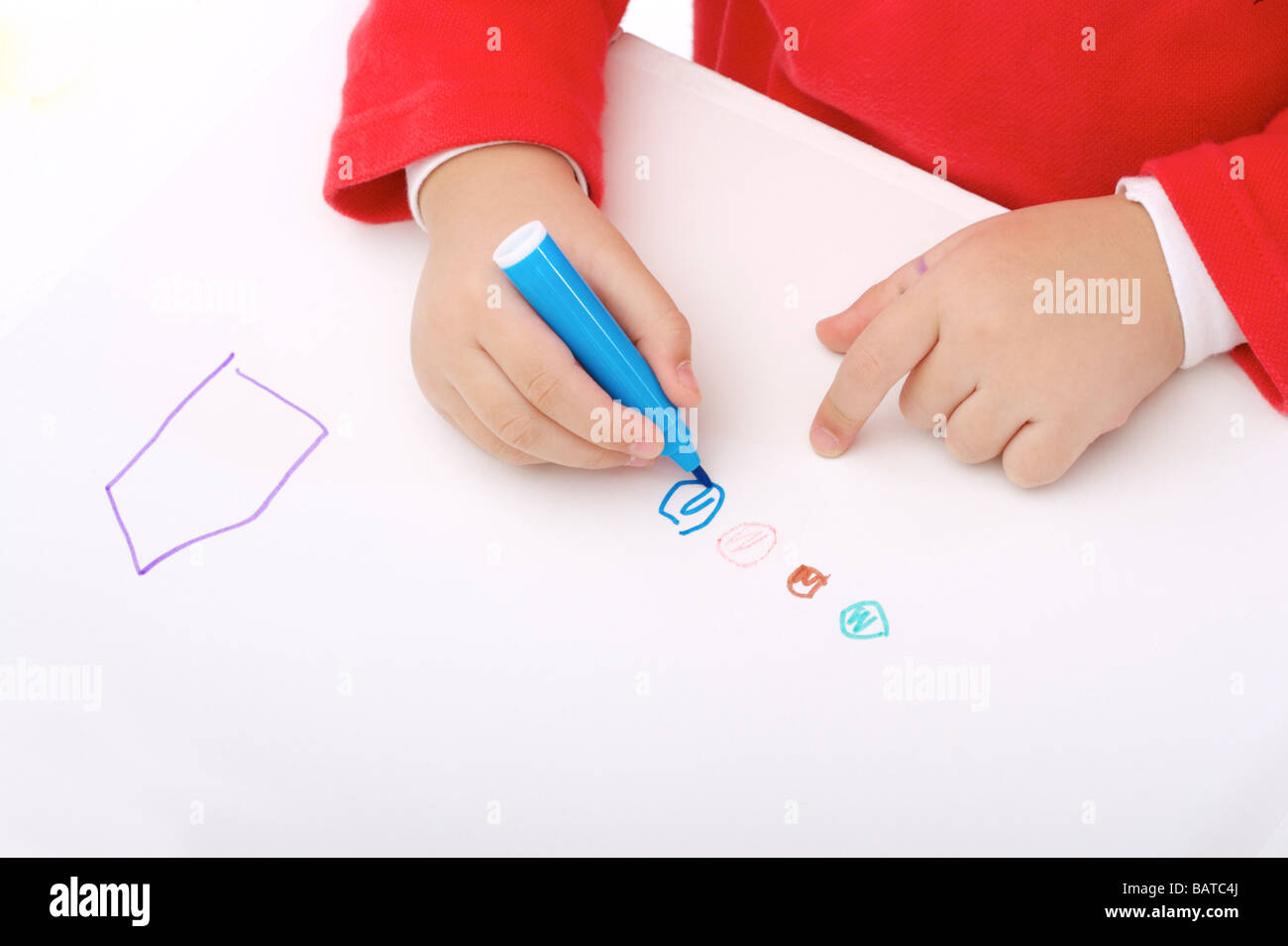 Boy drawing on paper Stock Photo - Alamy
