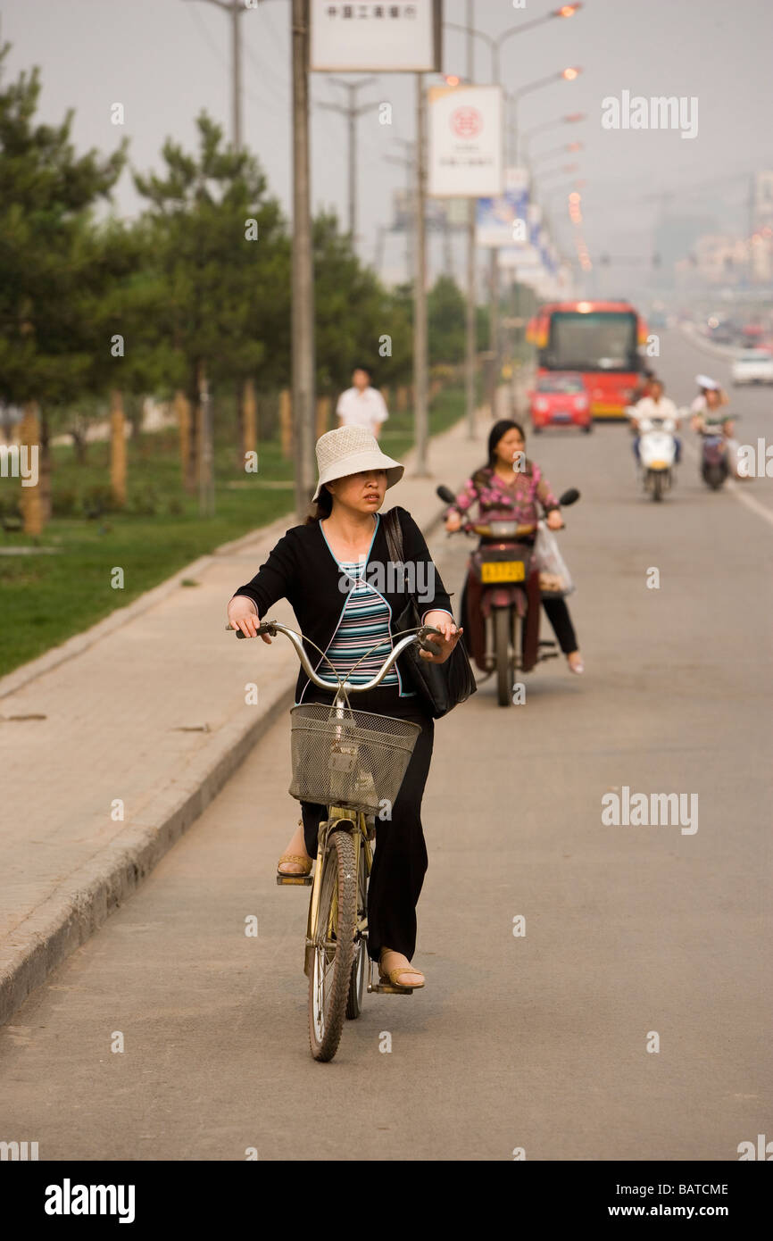 Girl riding bike china hi-res stock photography and images - Alamy