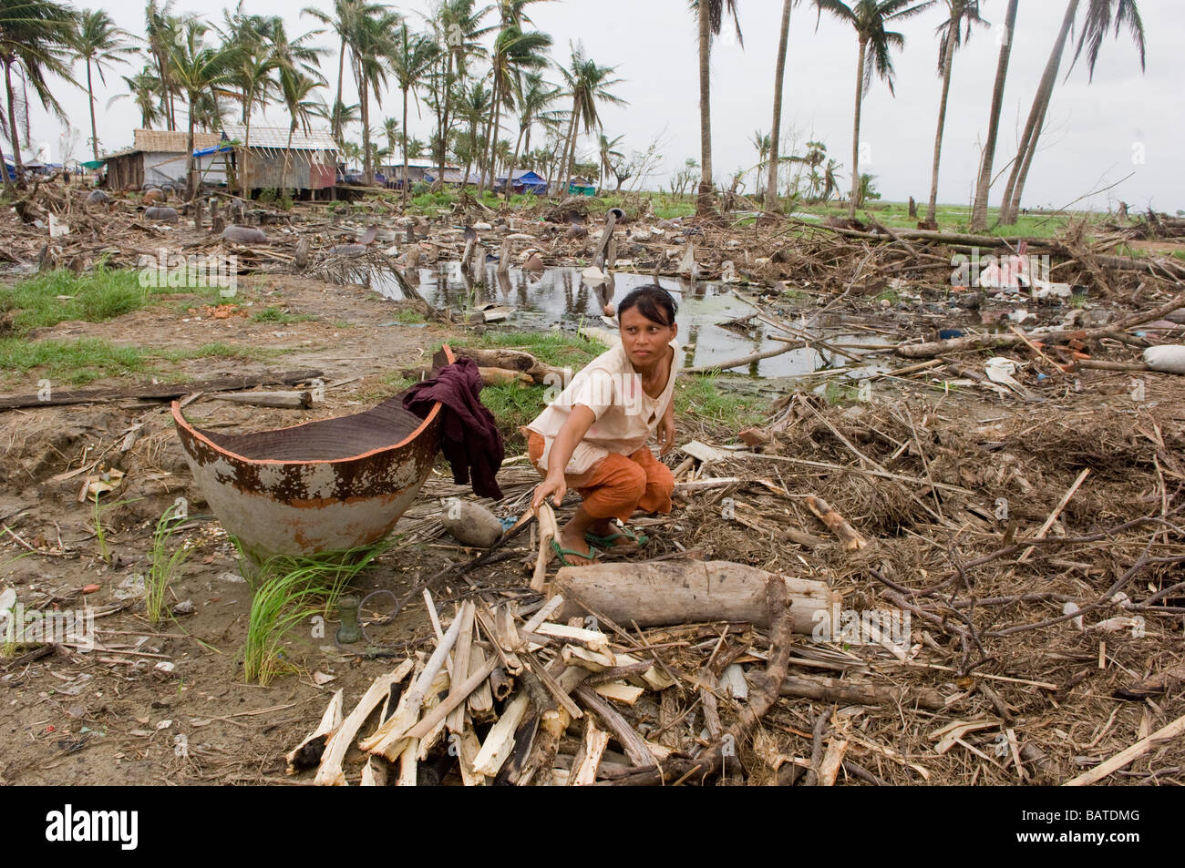 Female survivor makes a fire in Gongi village Labutta after Cyclone ...