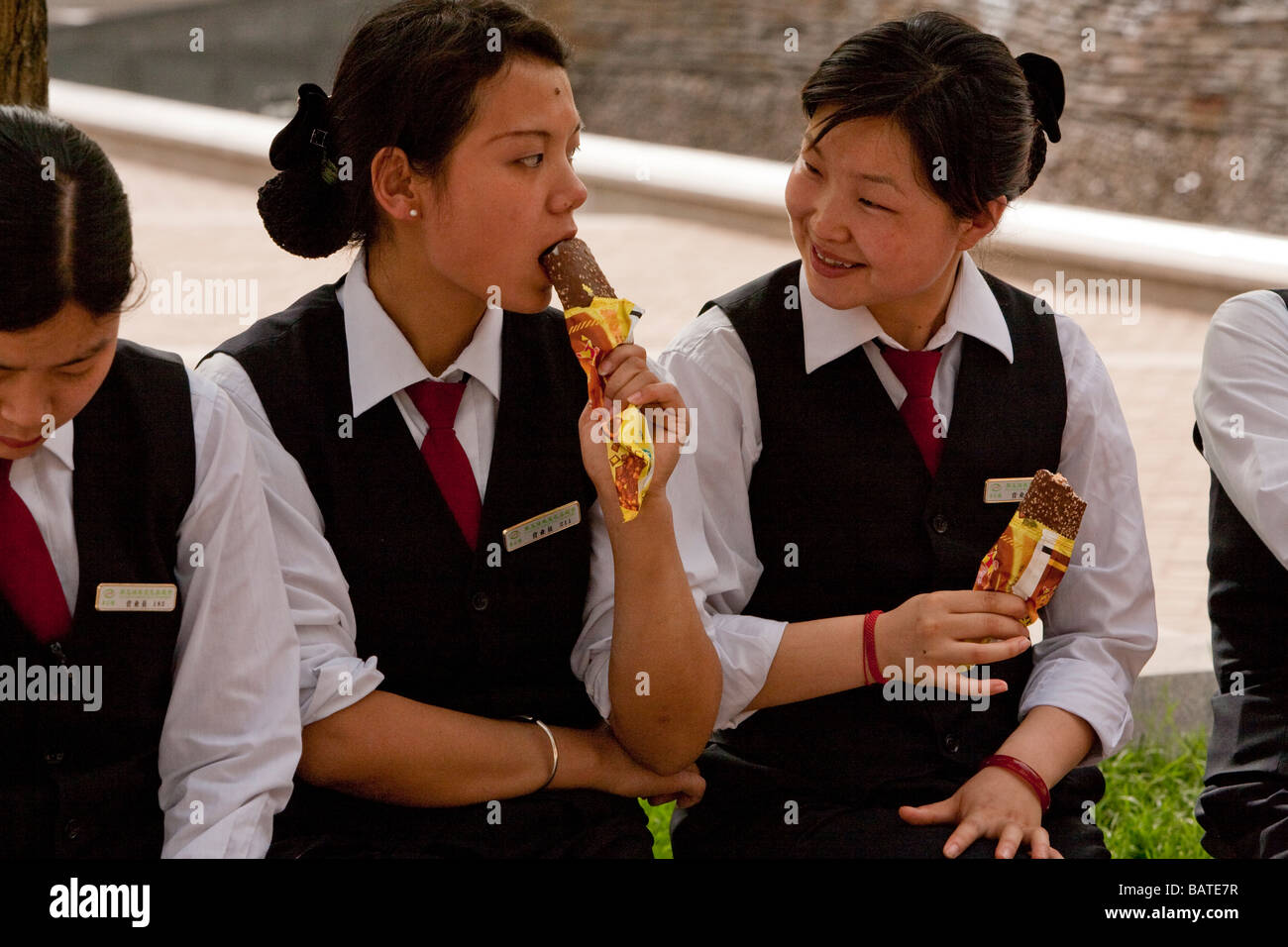 Beijing China Three young fast food restaurant workers take a break to ...