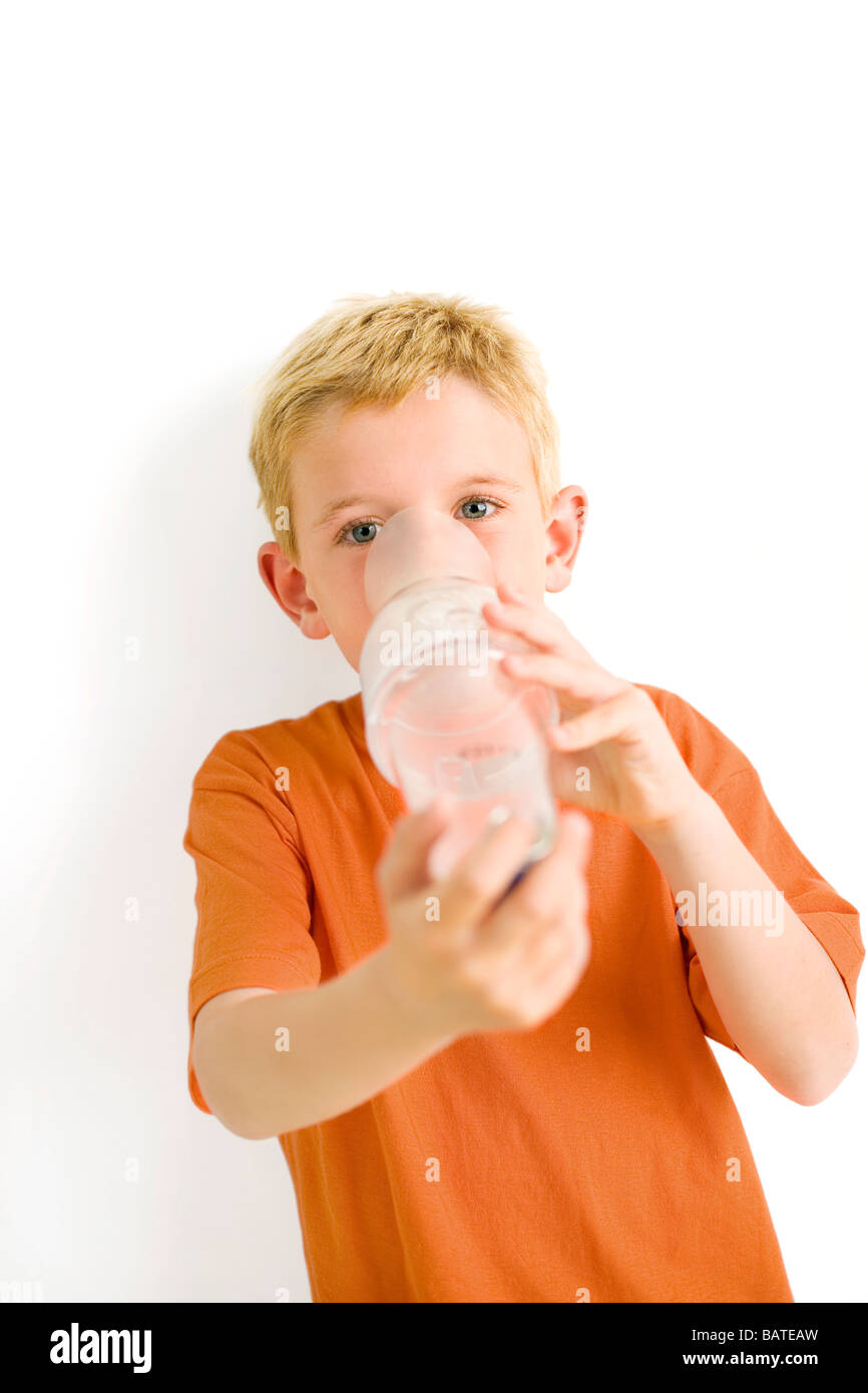Child using inhaler and spacer hi-res stock photography and images - Alamy