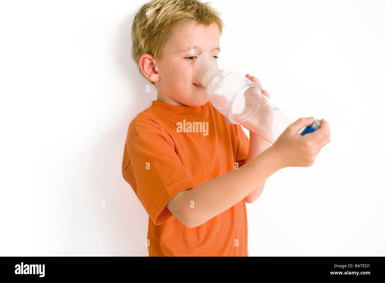 Child using inhaler and spacer hi-res stock photography and images - Alamy