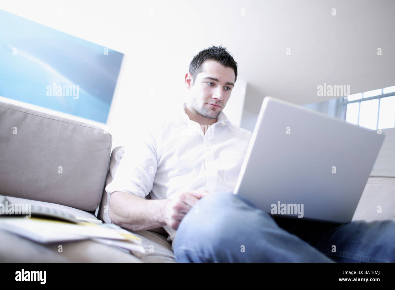 Laptop use. Man working at a laptop Stock Photo - Alamy