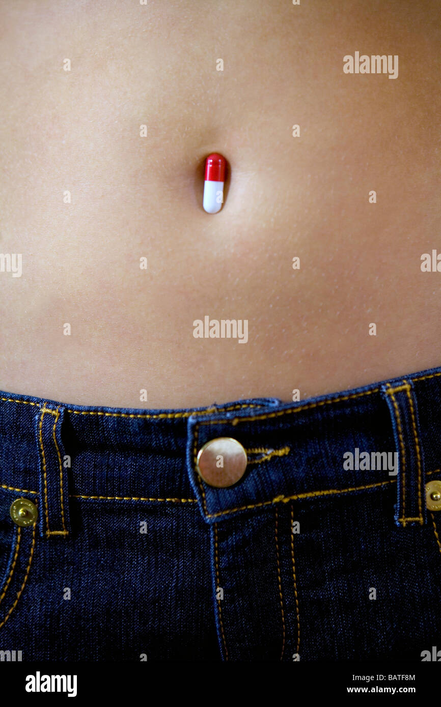 woman pill in the navel Stock Photo - Alamy