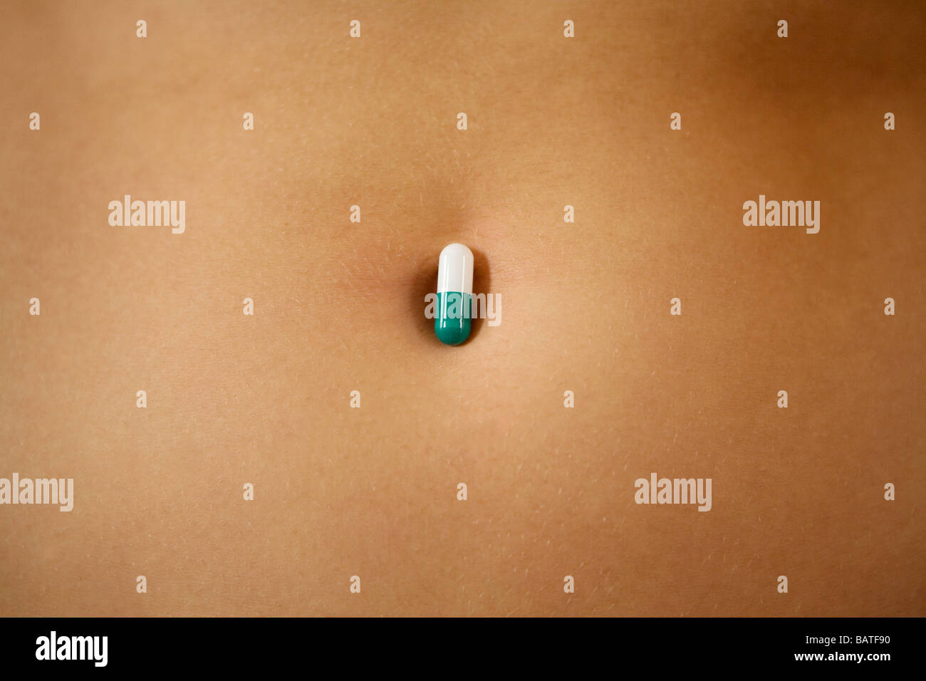 woman pill in the navel Stock Photo - Alamy