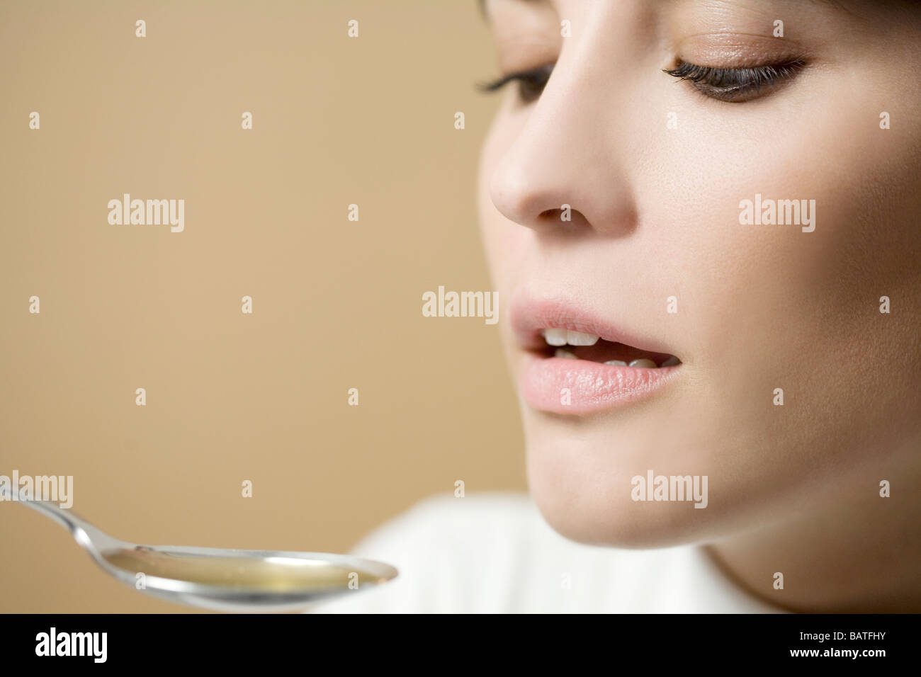 Taking medicines to his mouth hi-res stock photography and images - Alamy