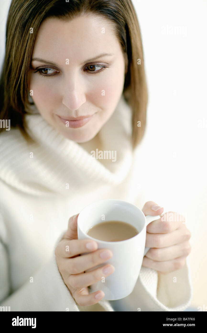 Woman drinking tea Stock Photo - Alamy