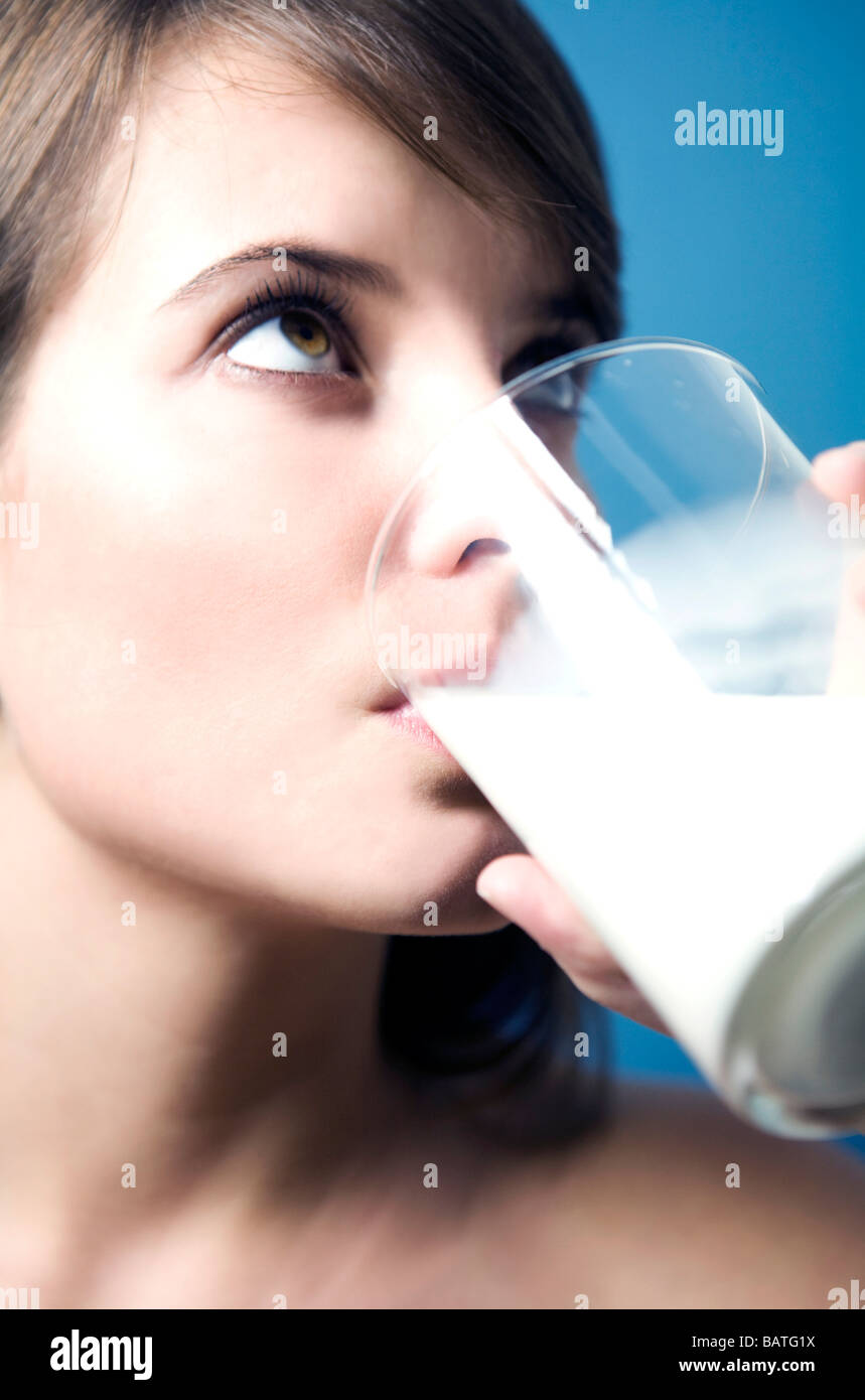 young woman drinking milk Stock Photo - Alamy