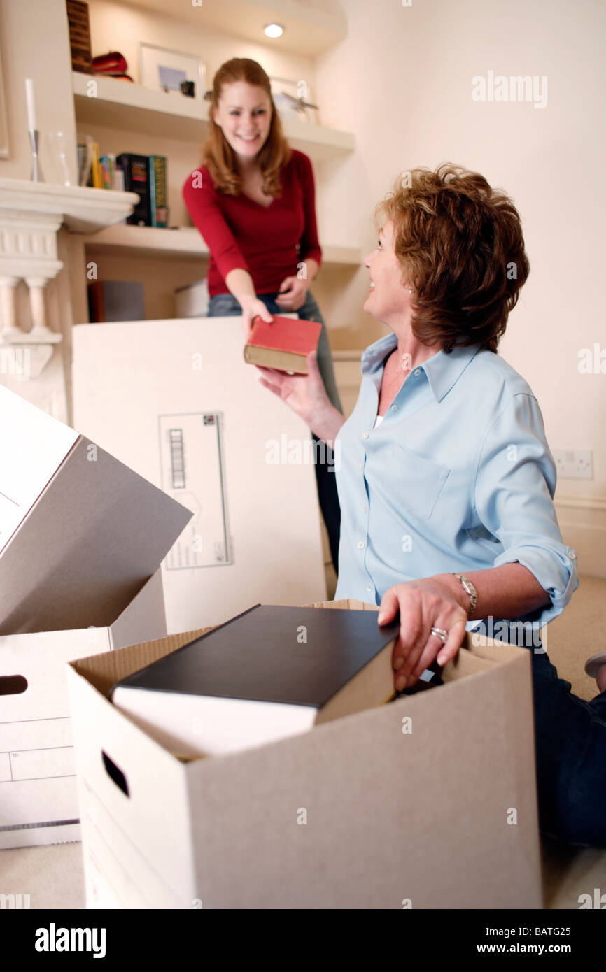 Woman packing books box High Resolution Stock Photography and Images ...