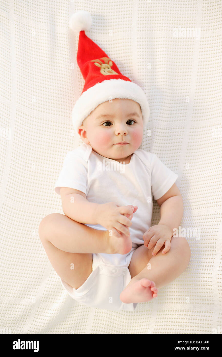 Baby boy. Nine month old boy wearing a Christmas hat Stock Photo - Alamy Baby boy. Nine month old boy wearing a Christmas hat Stock Photo - Alamy