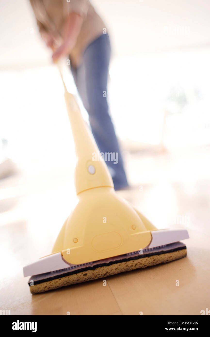 Woman mopping a floor Stock Photo - Alamy