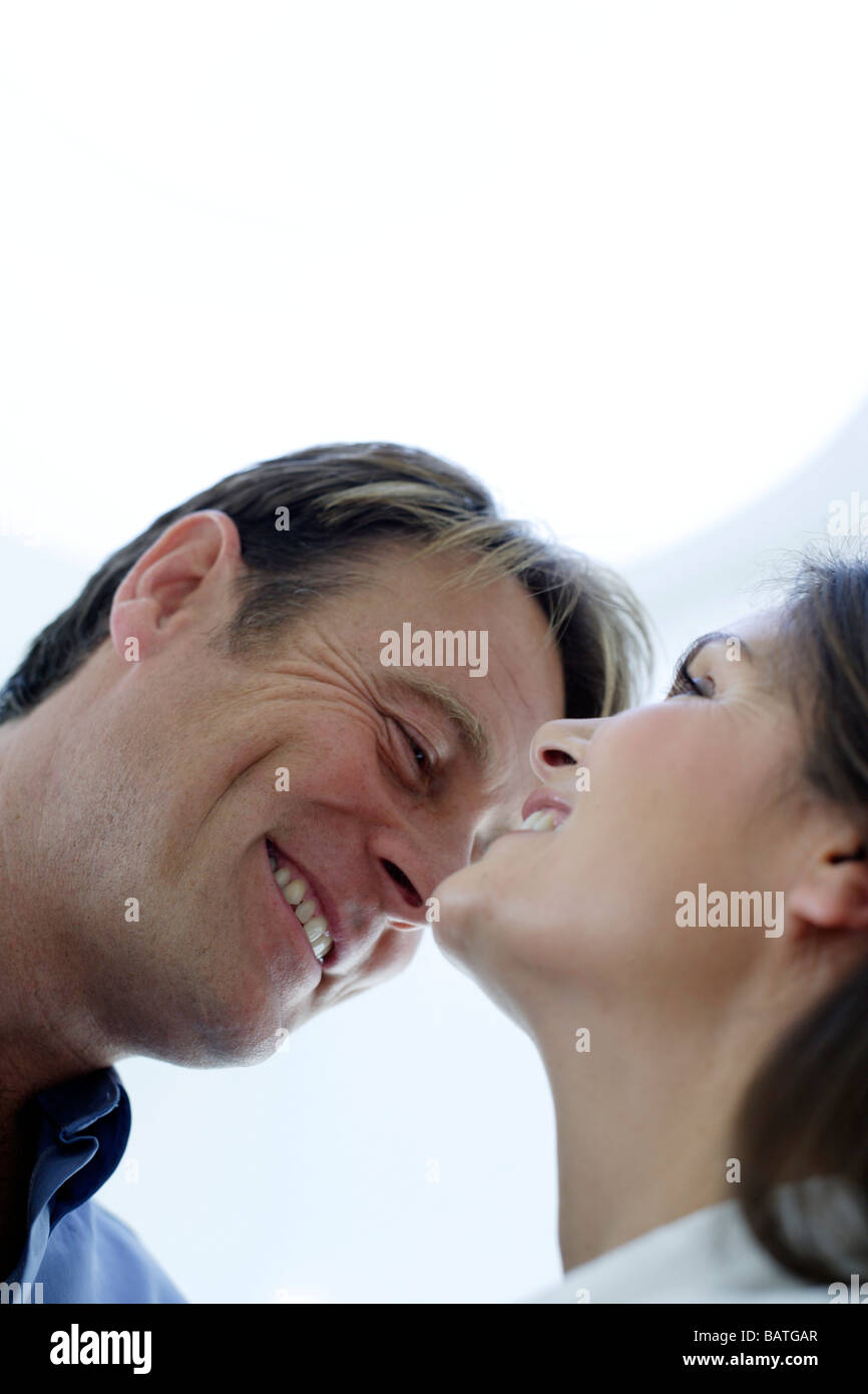 Happy couple laughing Stock Photo - Alamy