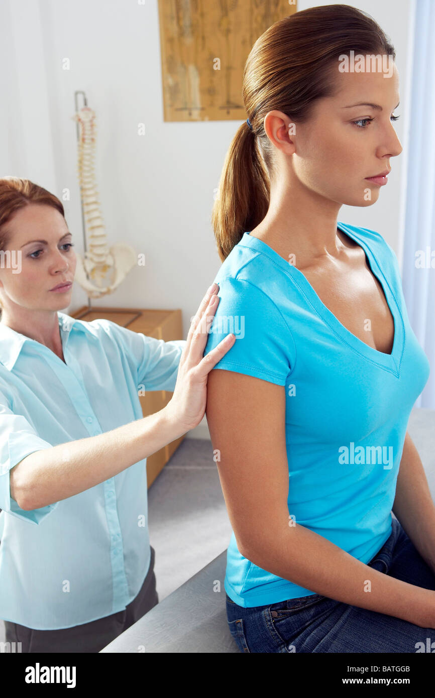 Chiropractic examination of the thoracic spine. The chiropractor is ...