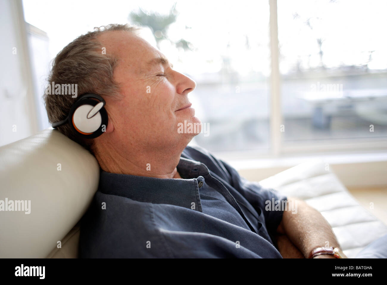 Man using headphones Stock Photo - Alamy