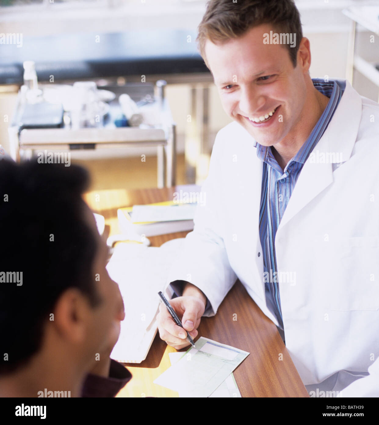 Prescription. General practice doctor writing out a prescription Stock ...