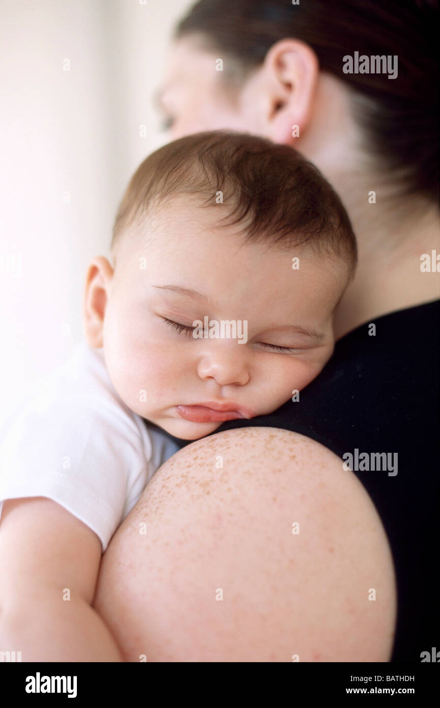 Sleeping baby. Head of asleeping 5-month-old baby girl resting on her ...