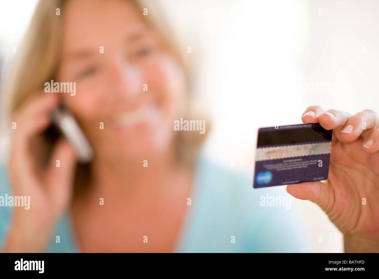 Credit card purchasing. Woman making a credit card purchase over ...