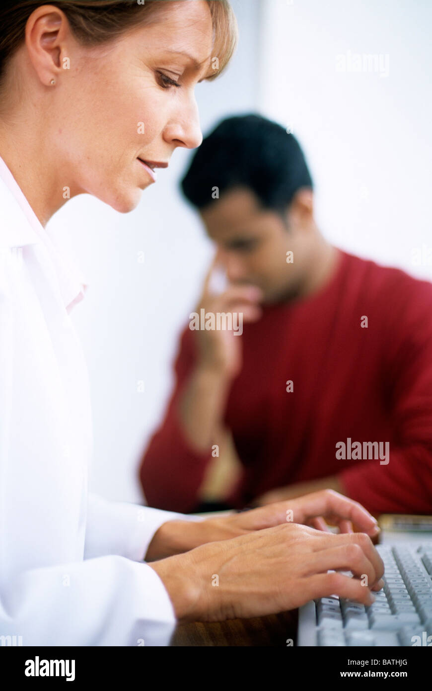 Medical consultation. Generalpractice doctor typing notes during a ...