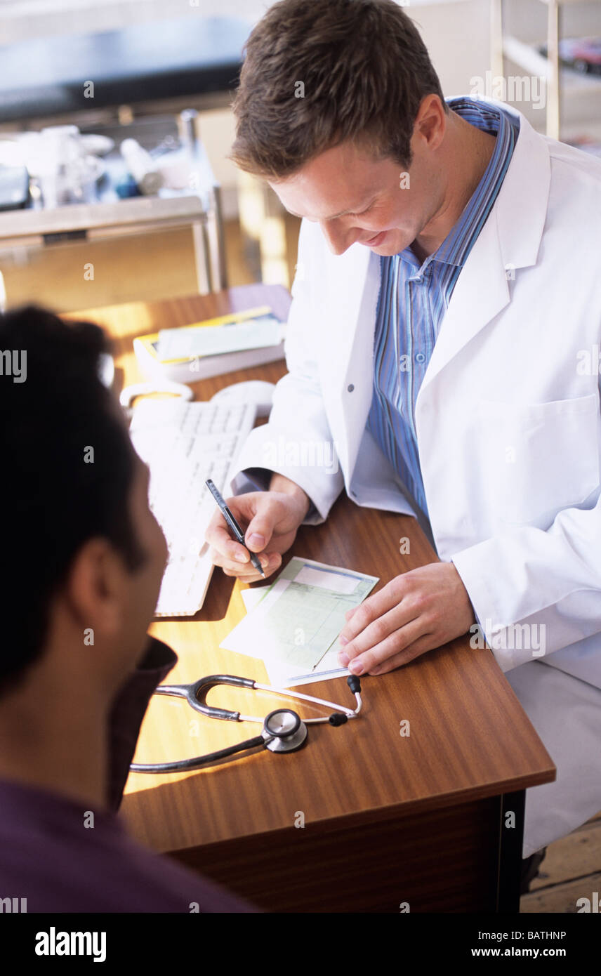 Doctor writing out a prescription hi-res stock photography and images ...