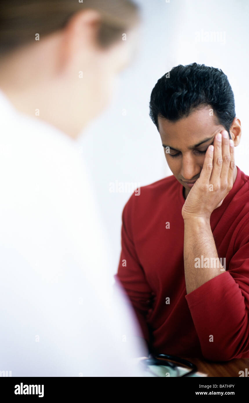 Medical consultation. Male patient consulting his general practioner ... Medical consultation. Male patient consulting his general practioner ...