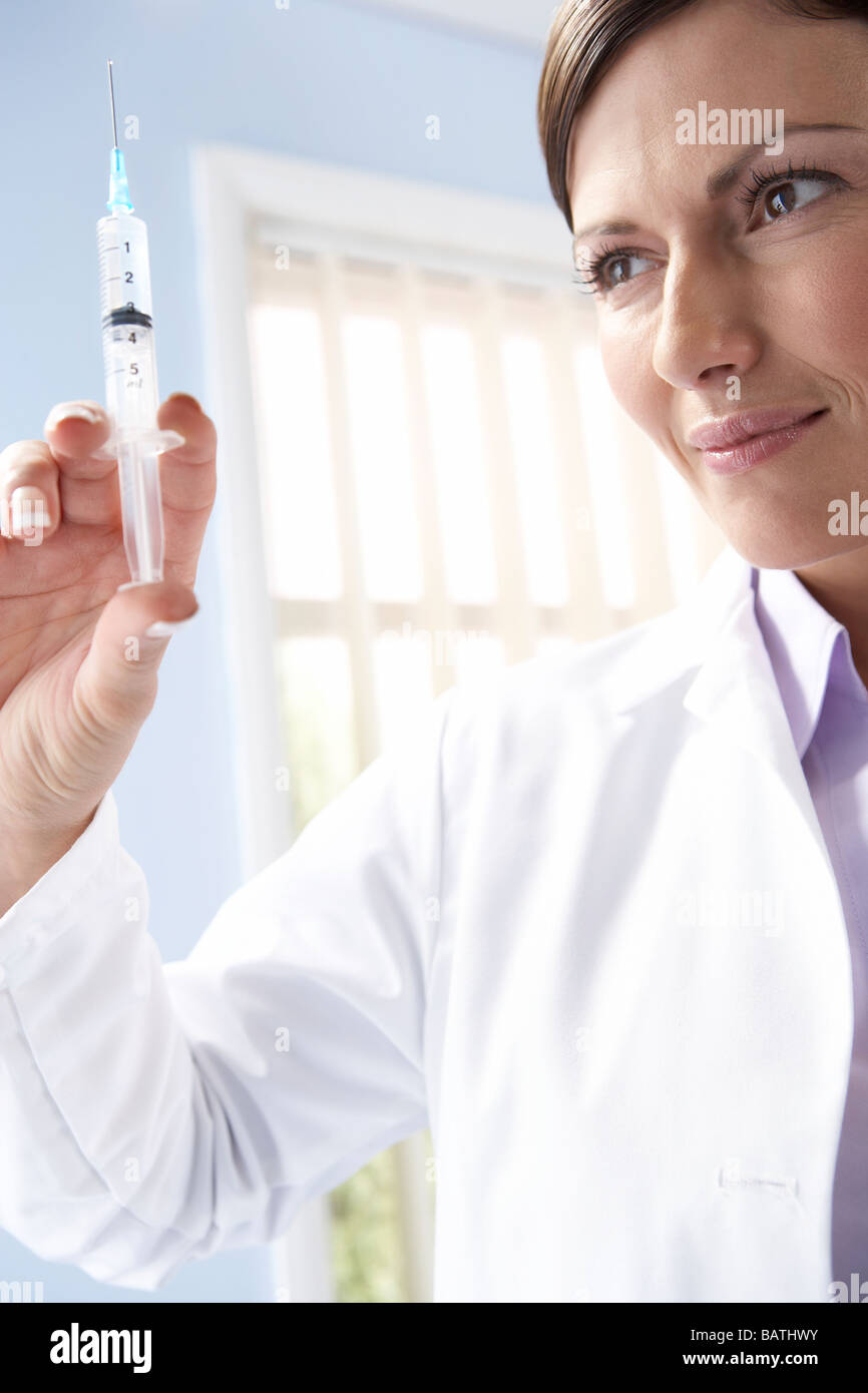 Doctor preparing an injection Stock Photo - Alamy