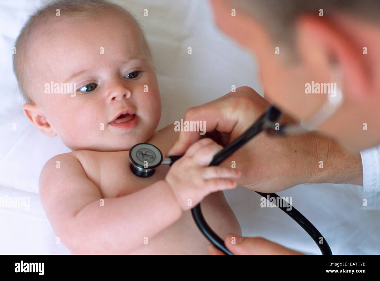 Doctor examining babies heart hi-res stock photography and images - Alamy