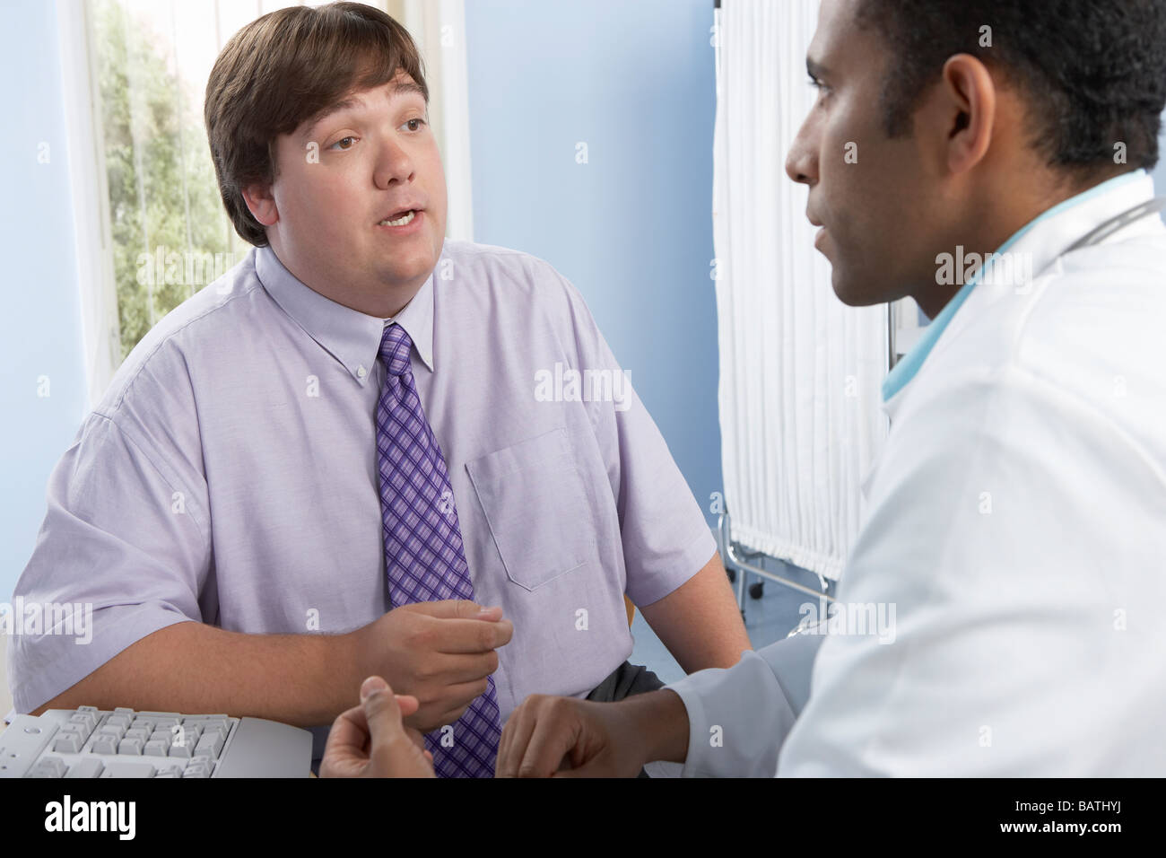 Doctor obese patient talking hi-res stock photography and images - Alamy
