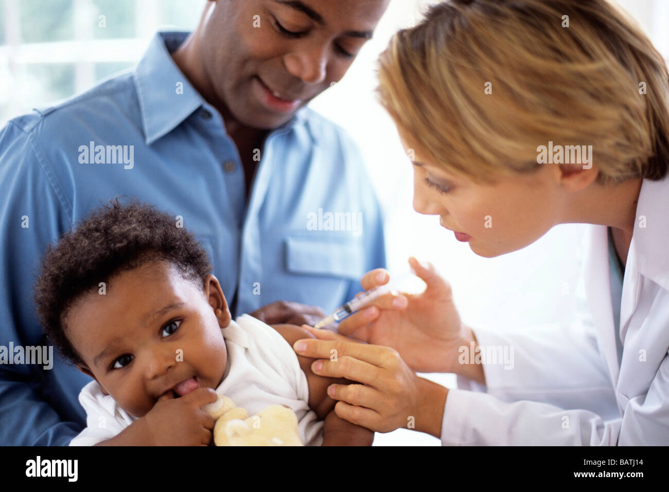 Doctor Giving Injection To Baby