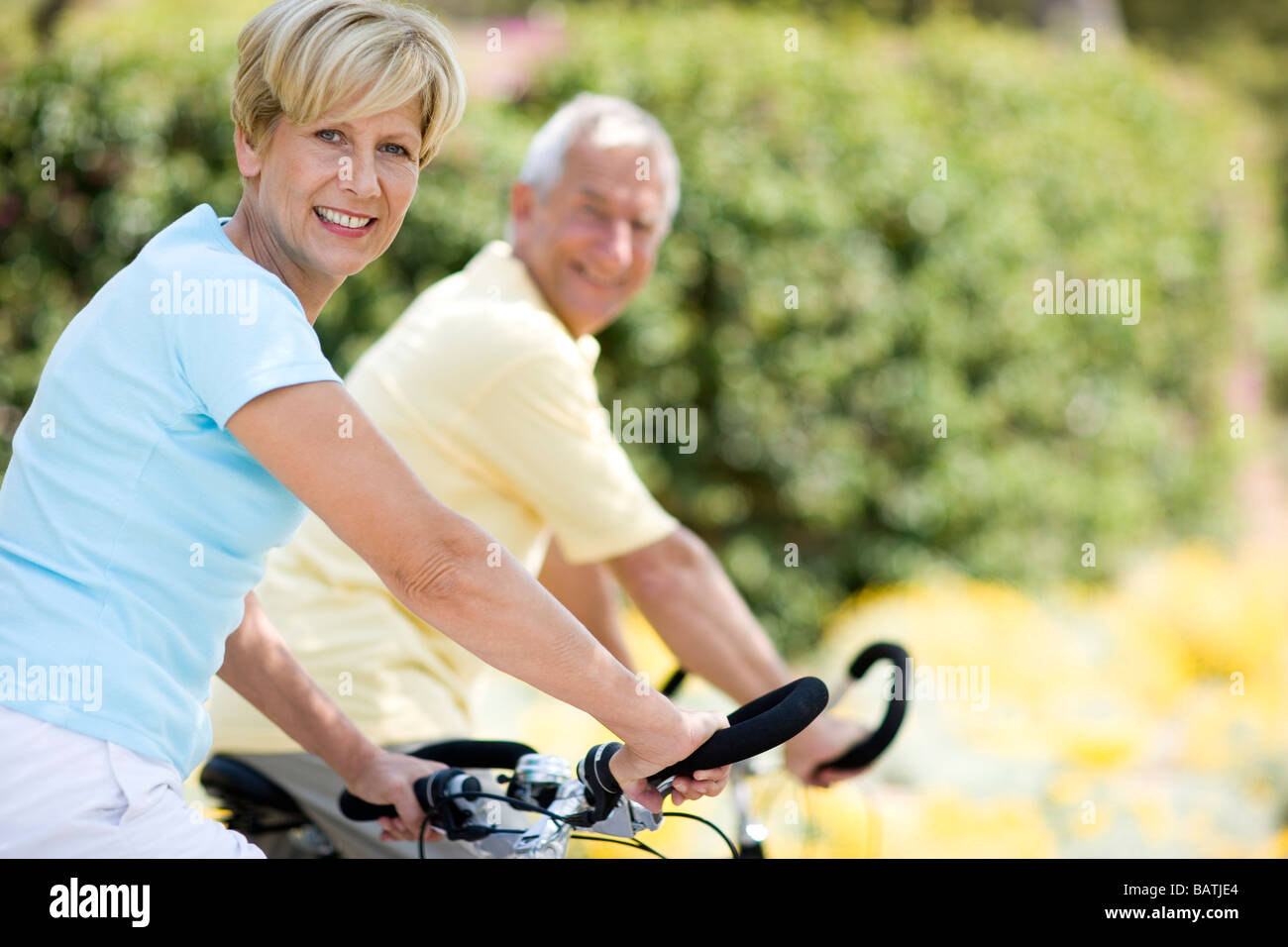 Cyclists. Smiling couple enjoying a cycle ride in the countryside Stock ...