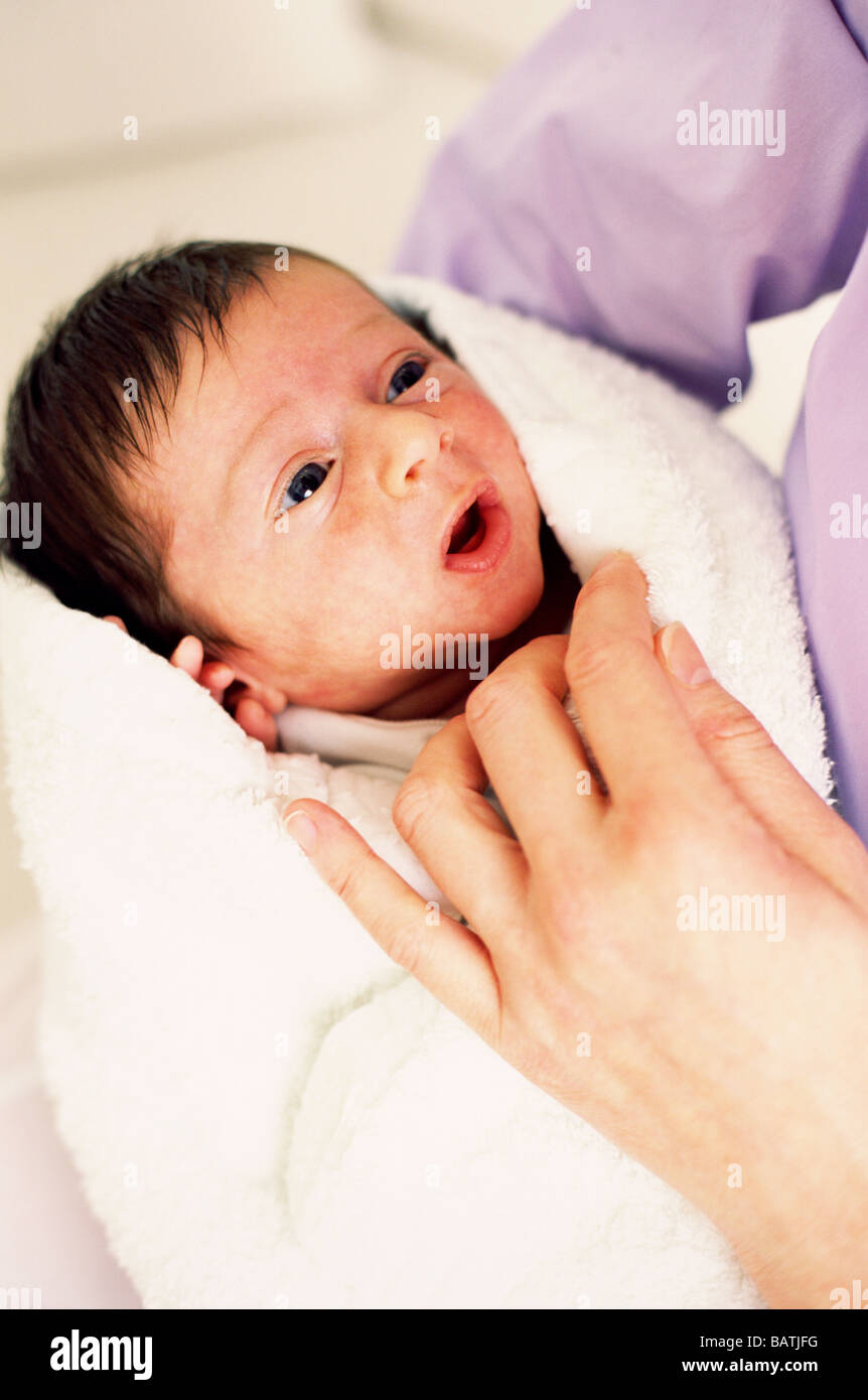 New born baby. Two week old baby boy wrapped in a blanket Stock Photo ...