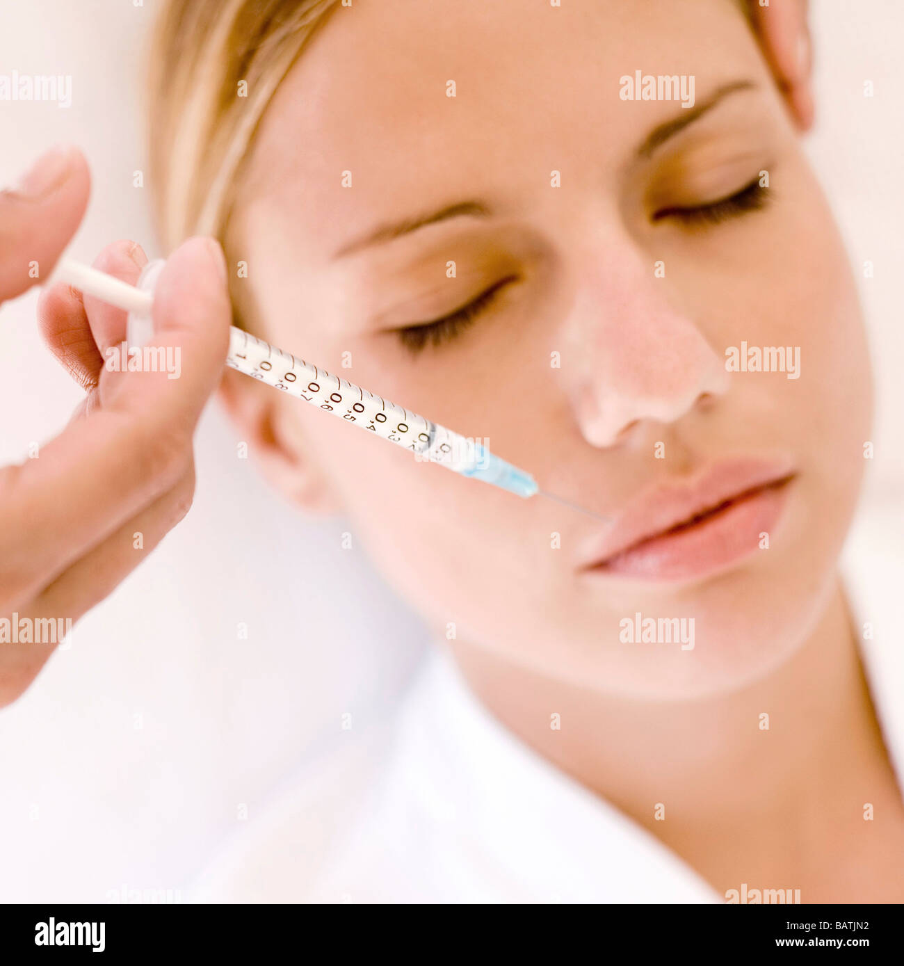 Botox treatment. Client having botox injected into her face. Botox is ...