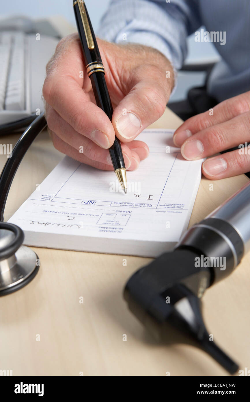 Prescription. General practice doctor writing a prescription Stock ...
