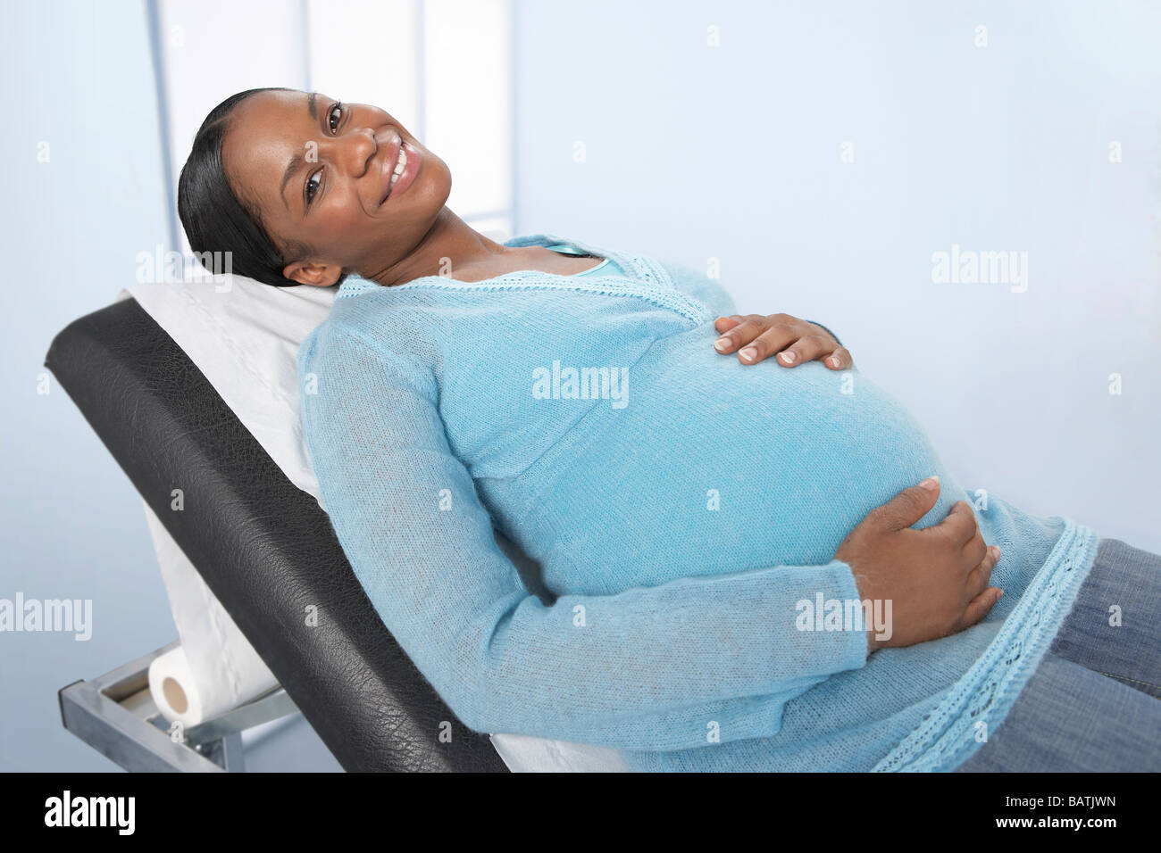 Woman pregnant lying on table hi-res stock photography and images - Alamy