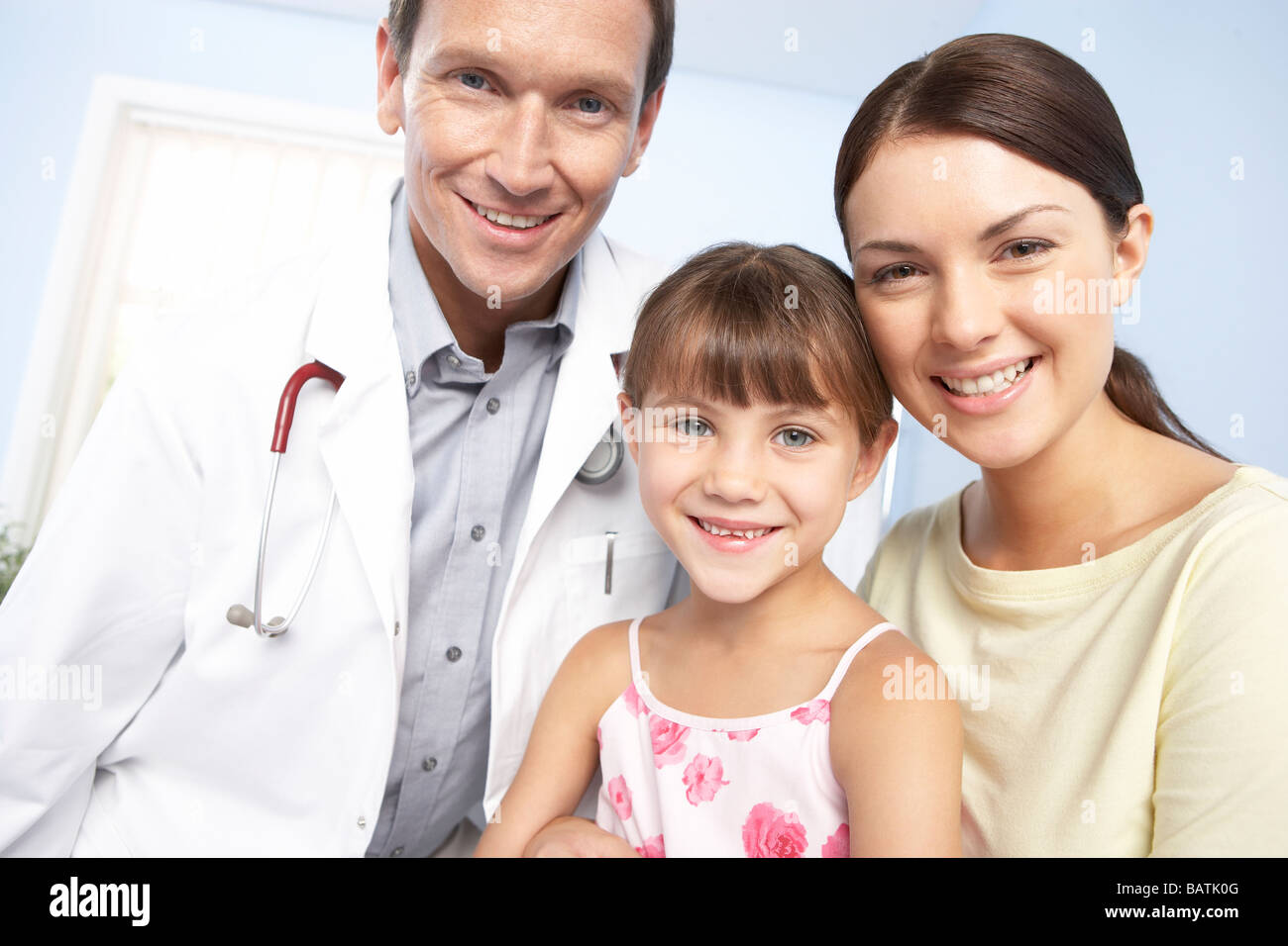 Family doctor with a girl patient and her mother Stock Photo - Alamy