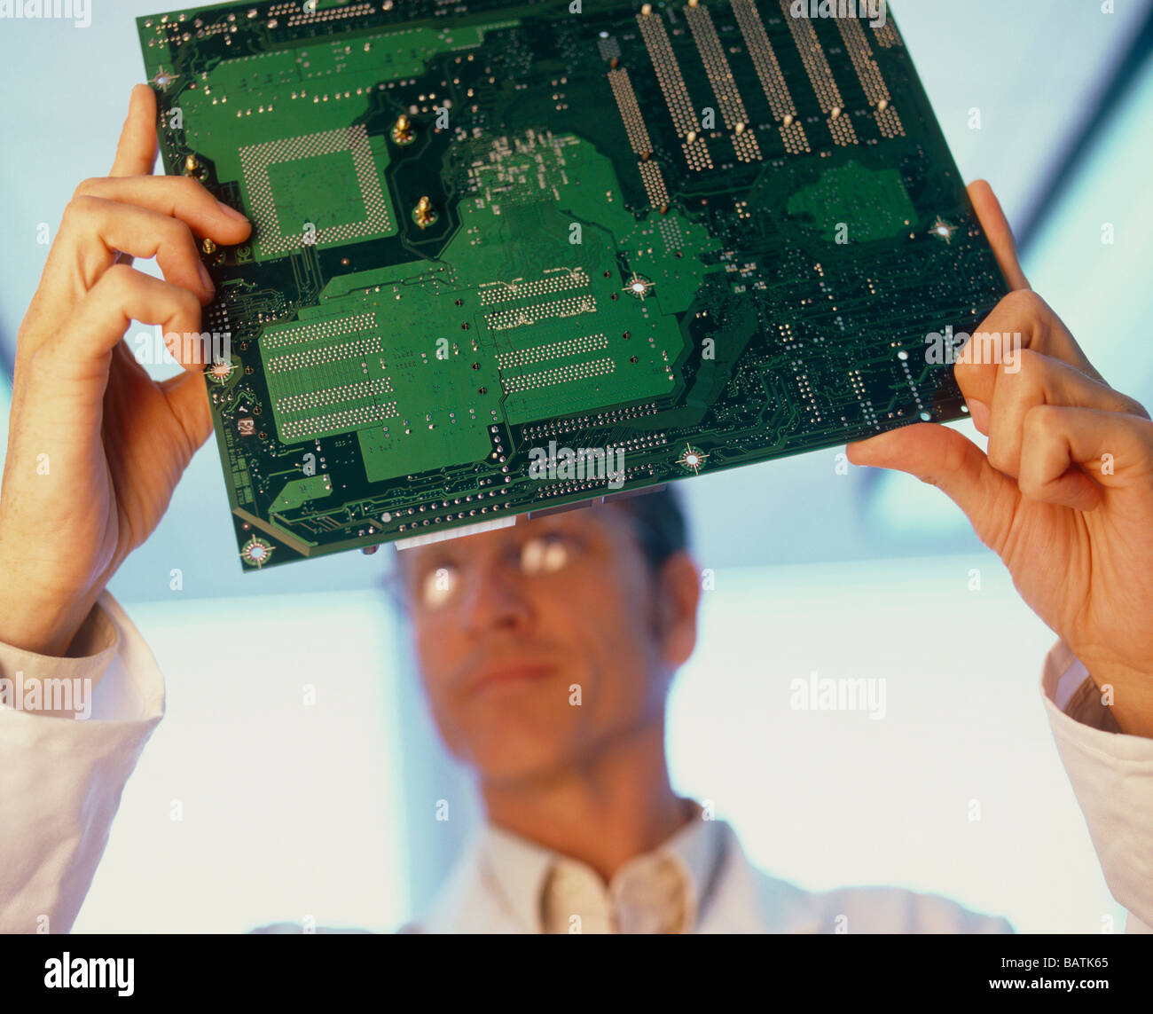 Checking electronics circuit board hi-res stock photography and images ...
