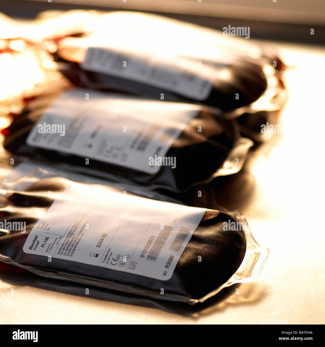Blood bags labelled with barcodes. Donor blood is processed before use ...